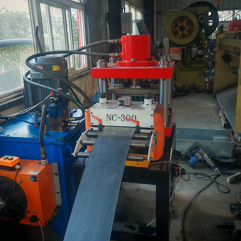 Electric cable tray forming machine in operation