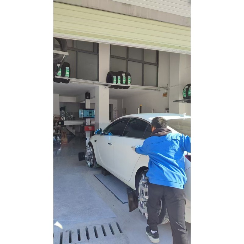 X6 Smart 3D Wheel Aligner in operation at auto repair shop