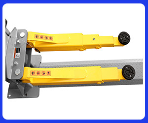 Basement style 2 post car lift showing asymmetric design