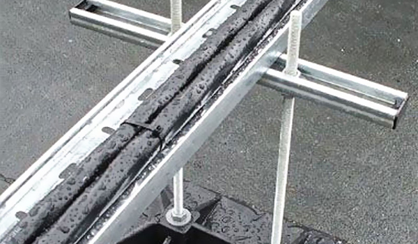 Close-up view of cable tray machine components