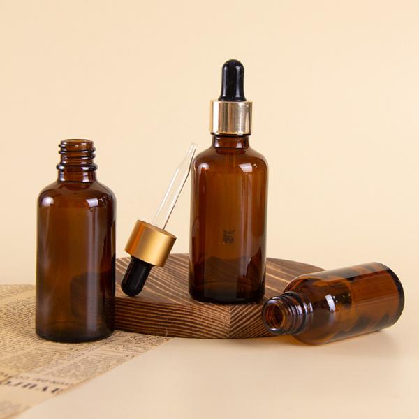 Quality Essential Oil 15ml 30ml 60ml Empty UV Gold Coating Liquor Glass Dropper Bottle for sale