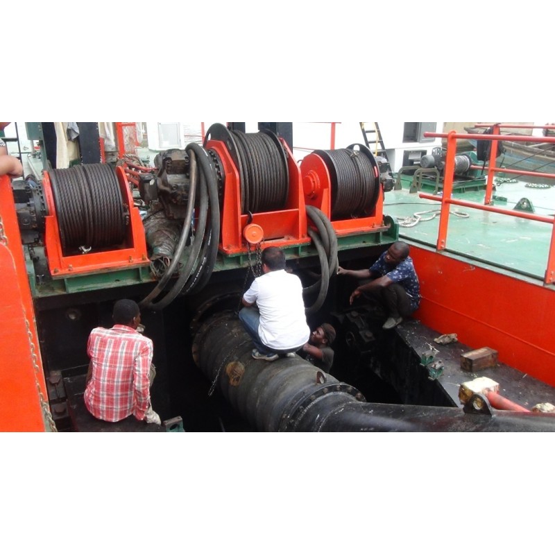 Technical team installing dredger components