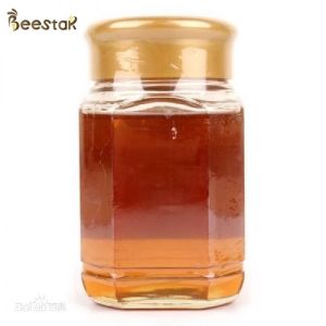 Quality 100% Pure Raw Natural Bee Honey with Amber Color and 76.5% Reduce Sugar for sale