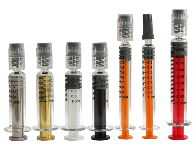 Close-up view of syringe filling machine components