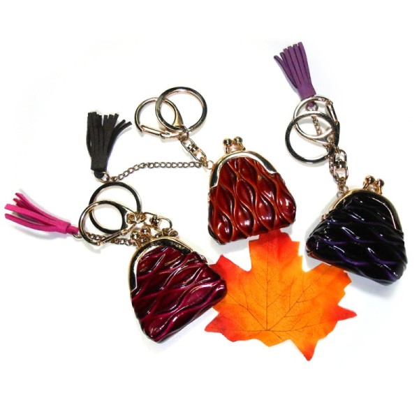 Quality ODM Coin Wallet Embossed Leather Keychain With Red Tassel Decoration for sale