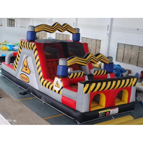 Quality Danger Obstacles Inflatable Bounce House Castles With Two Slides for sale