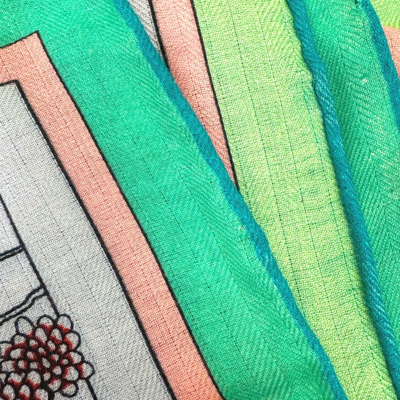 Close-up detail of cashmere fabric texture and print quality showing fine fibers and vibrant color absorption