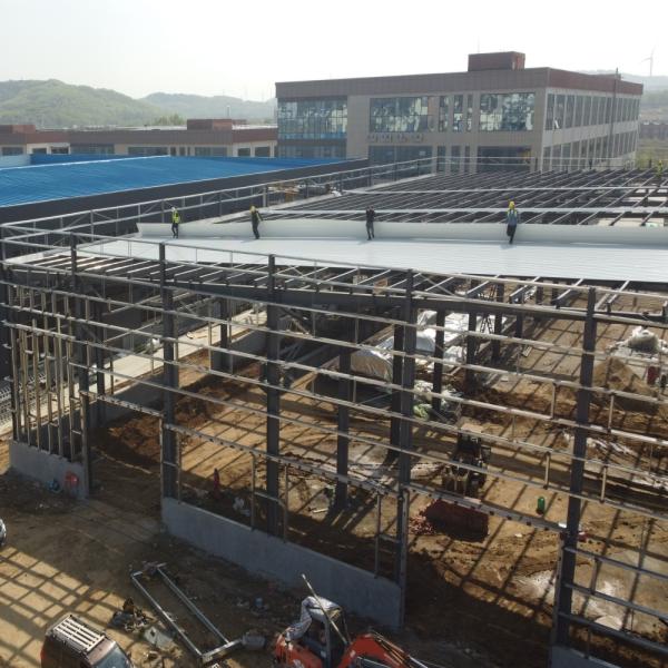 Quality Arch Roof Steel Frame Building with H-Section Beams 50-Year Lifespan for sale