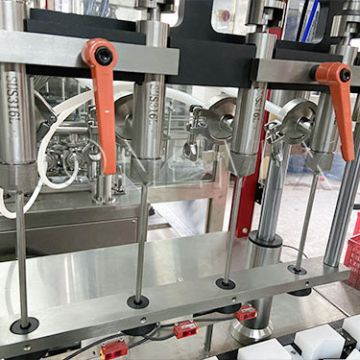 Quality Custom Four Nozzle Cream Filling Machine Liquid Cycle Filling Line for sale