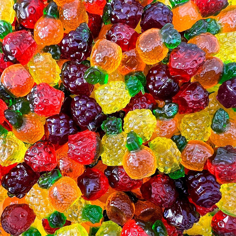 Colorful 3D 4D gummy candies in various shapes and fruit flavors