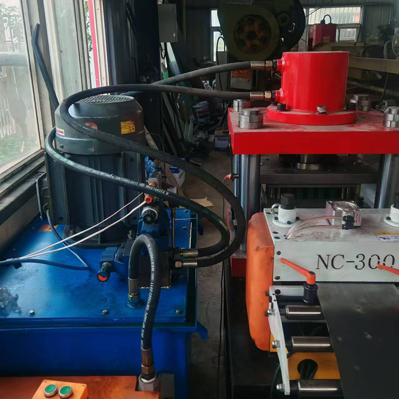 Close-up view of cable tray forming machine components