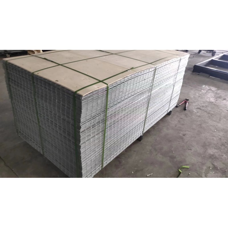 Close-up view of welded wire mesh connections and zinc coating