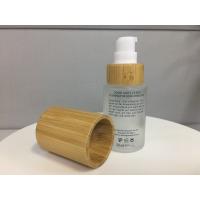 Quality SGS MSDS Bamboo Cosmetic Packaging Cylinder Glass Lotion Pump Bottle for sale