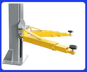 Side view of car lift showing safety lock release system
