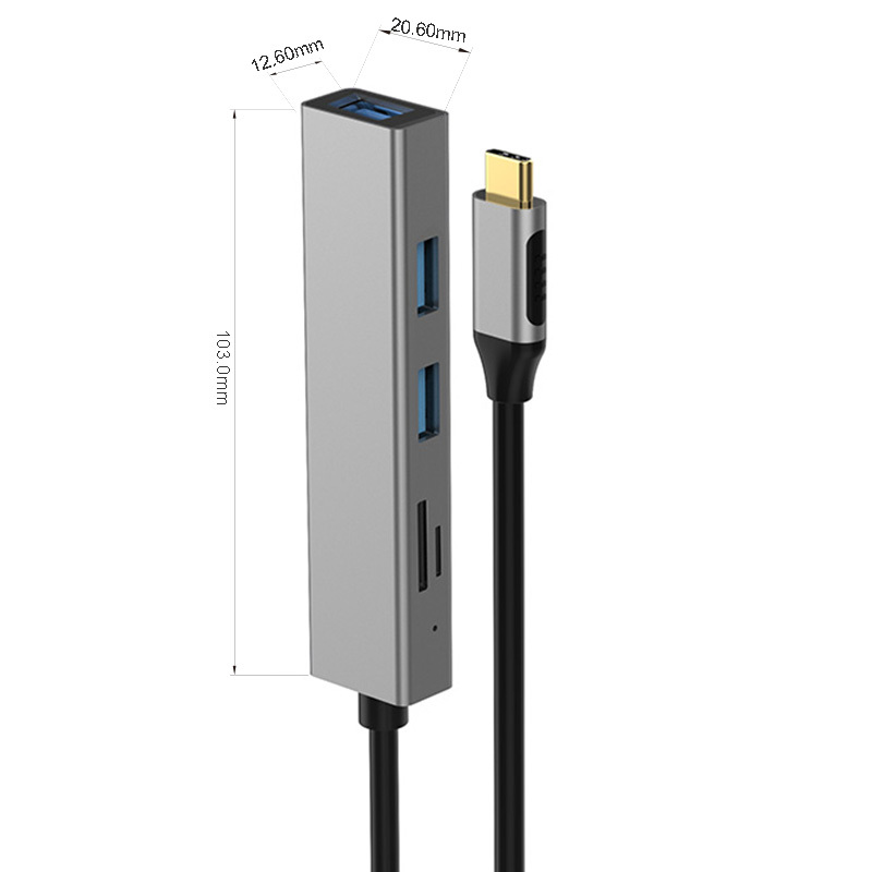 Close-up of USB-C hub showing card slots and USB ports