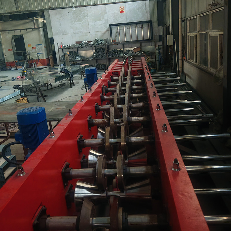 Cable tray making machine in operation showing metal forming process